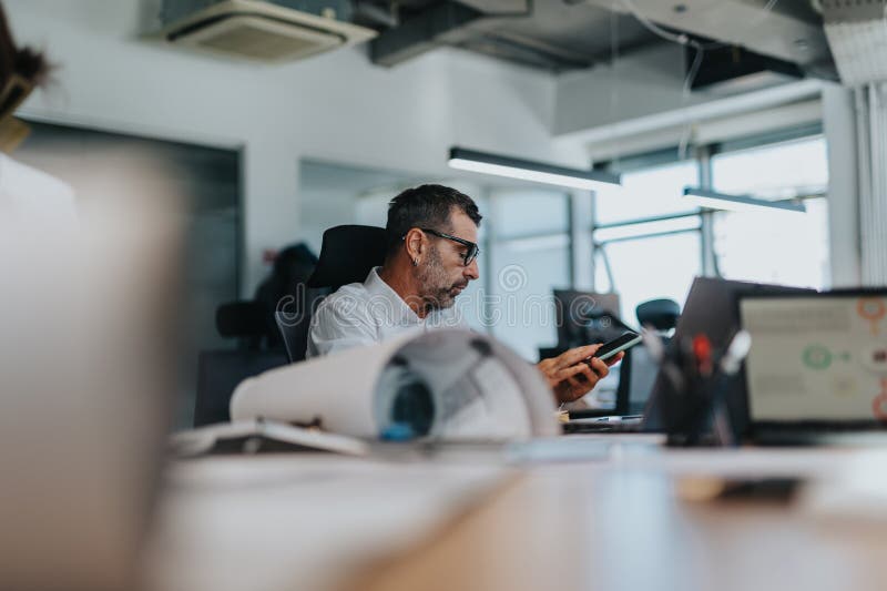Focused Business Professional Working at Modern Office Desk Stock Photo ...