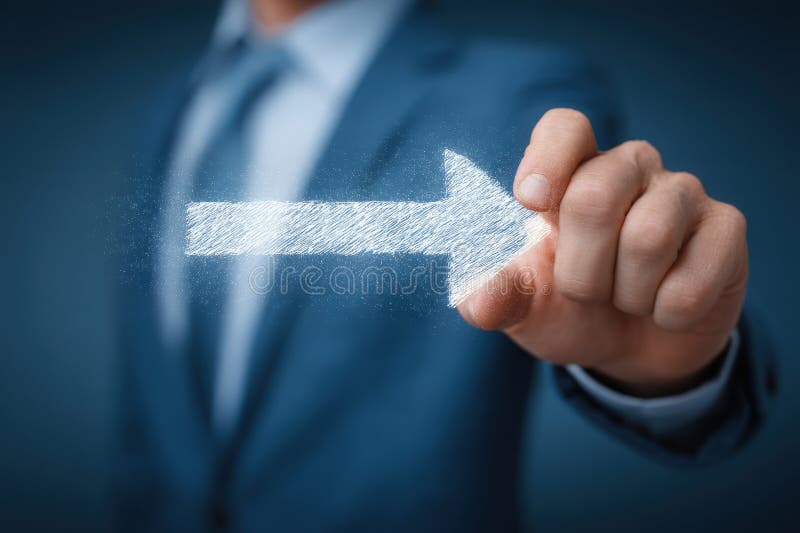 Business Professional Pointing an Arrow To Indicate Direction and ...