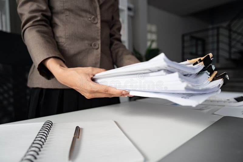 Business Professional Managing and Organizing Documents for a Project ...