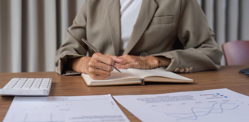 Professional Business Team Taking Meeting Notes during a Collaborative ...