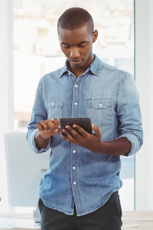 Business Professional Using Tablet in Modern Office, Focusing on ...