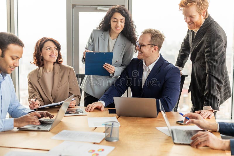Business Professionals Collaborating Around a Table in a Modern Office ...