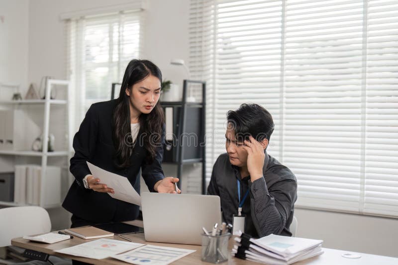 Concerned Female Professional Addressing Project Issues with a ...