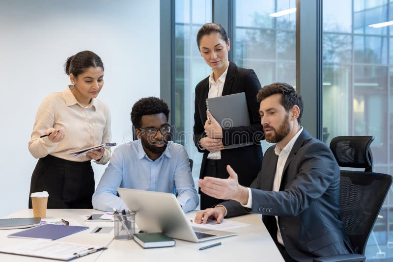 Business Professionals Collaborating Together in a Modern Office ...