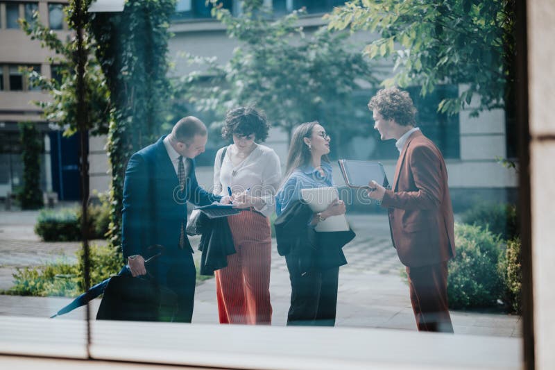 Business Professionals Discussing Work Outdoors in Urban Setting Stock ...