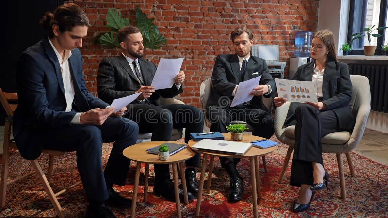 Business Professionals Engaged in a Focused Meeting Discussion Stock ...