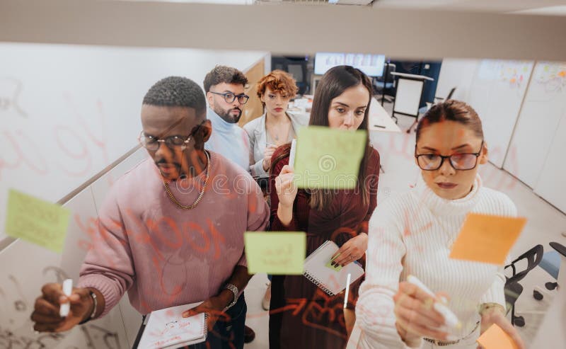 Business Professionals in a Glass-walled Office Collaborating, Problem ...