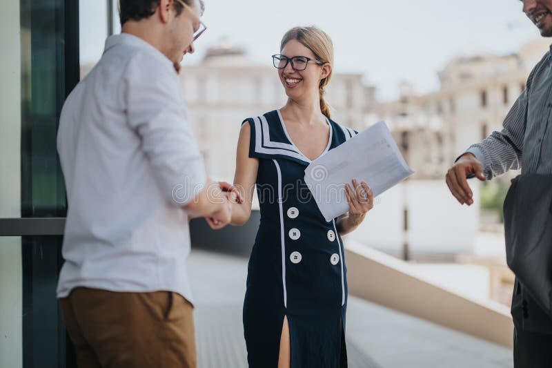 Business Professionals Greet Each Other with a Handshake Outdoors Stock ...