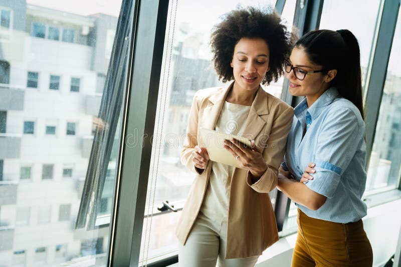 Business Partners Using Touchscreen Computer for Project Discussion ...