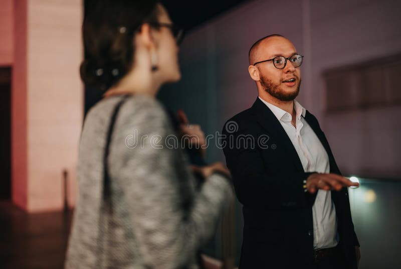 Business Professionals Networking and Talking at an Evening Event Stock ...