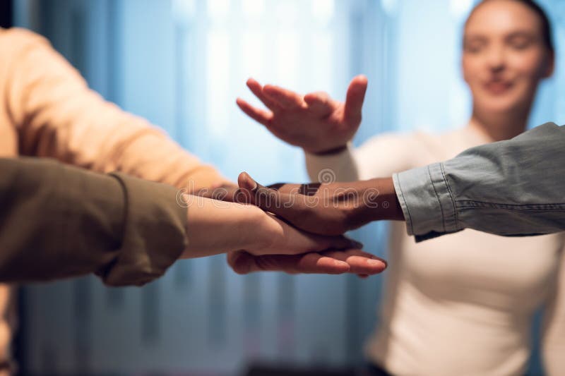 Business Professionals Stacking Hands in Support of Collaboration ...