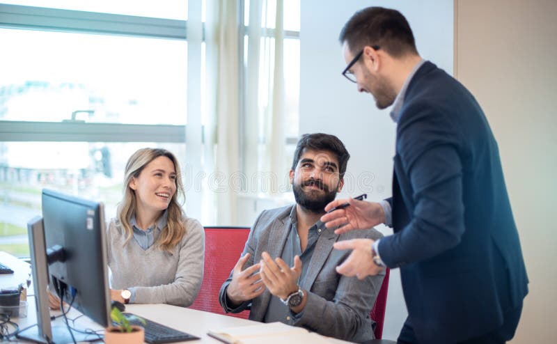 Business Professionals Talking To Each Other at Office Table, Speaking ...
