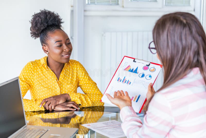 Business Professionals. Two Young Confident Business Women Analyzing ...