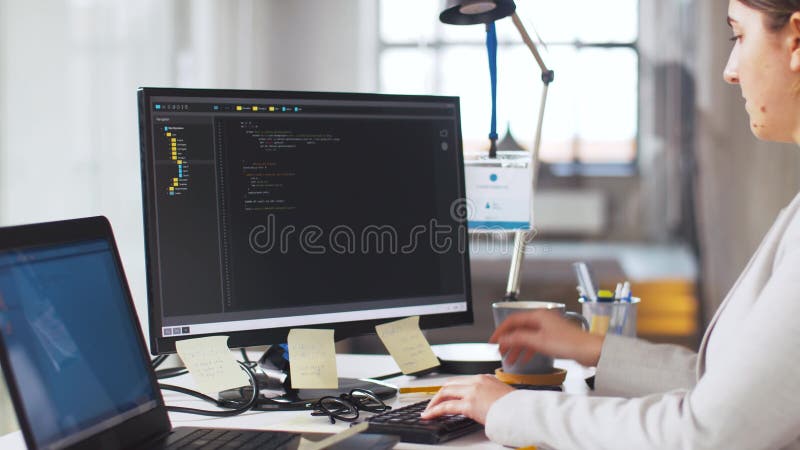 Programmer at Computer Working and Drinking Coffee Stock Footage ...