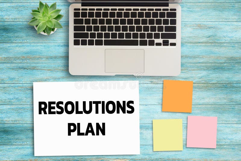 Business Quotes, RESOLUTIONS PLAN on Notebook or Paper in Office Desk ...