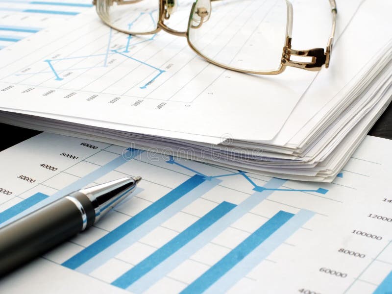 Business Report with Financial Charts. Stack of Papers in the Office ...