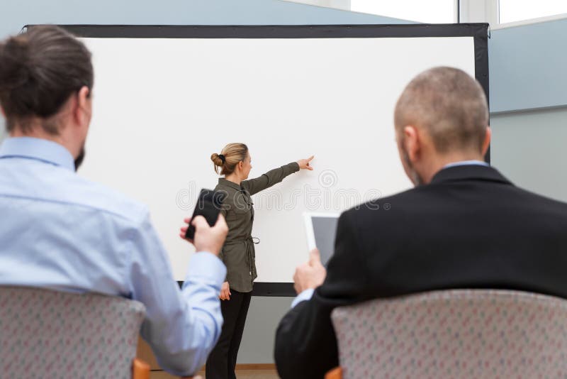 Business Seminar, Woman Standing at a Empty Whiteboard Stock Photo ...