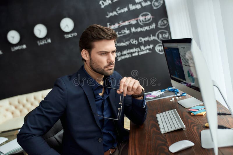 Business Statistic. Young Concentrated Businessman Looking at Computer ...