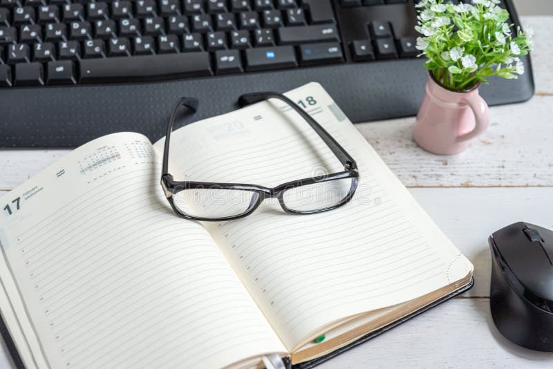 Business Still Life: a Working Notebook on the Table and a Computer ...