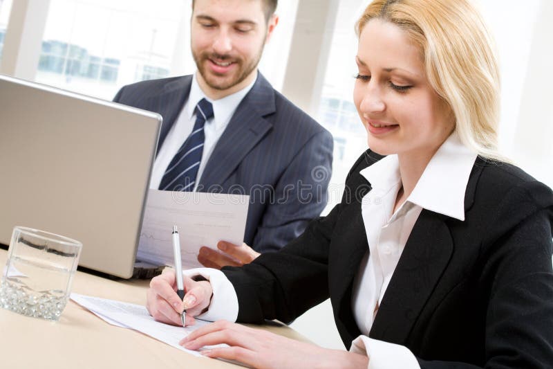 Reviewing files stock image. Image of colleagues, happy - 2228823