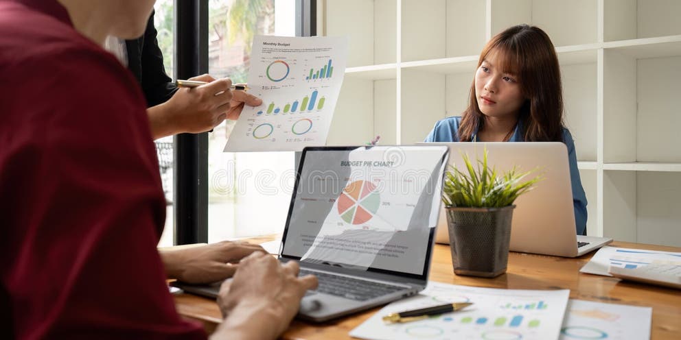 Business Team Analysis Financial Data and Discuss Strategy in Modern ...