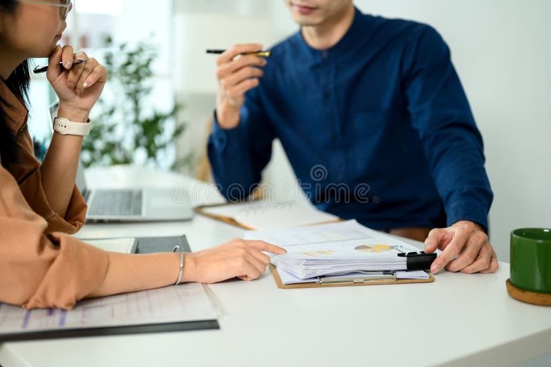 Business Team Analyzing Data and Making Business Decisions in a Shared ...