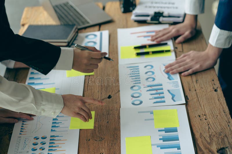 Business Team Analyzing Data Using Computer while Spending Time in ...