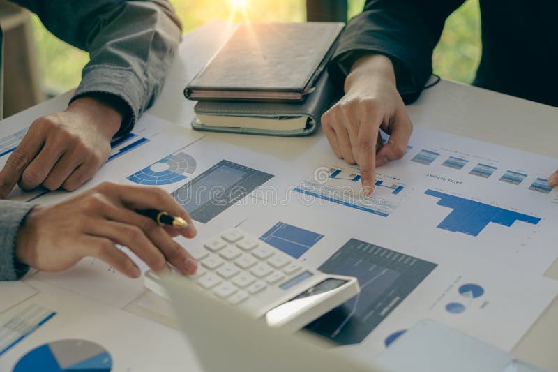 Business Team Analyzing Data Using Computer while Spending Time in ... Business Team Analyzing Data Using Computer while Spending Time in ...