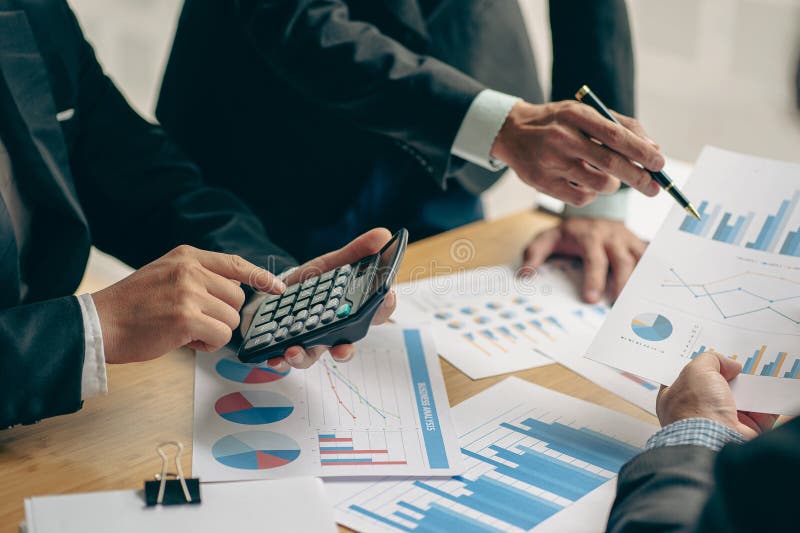 Business Team Analyzing Data Using Computer while Spending Time in ...