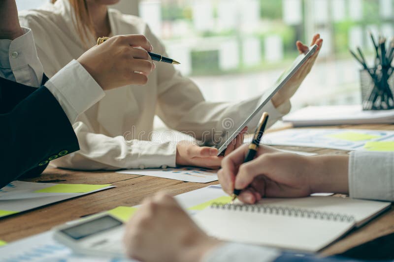 Business Team Analyzing Data Using Computer while Spending Time in ...
