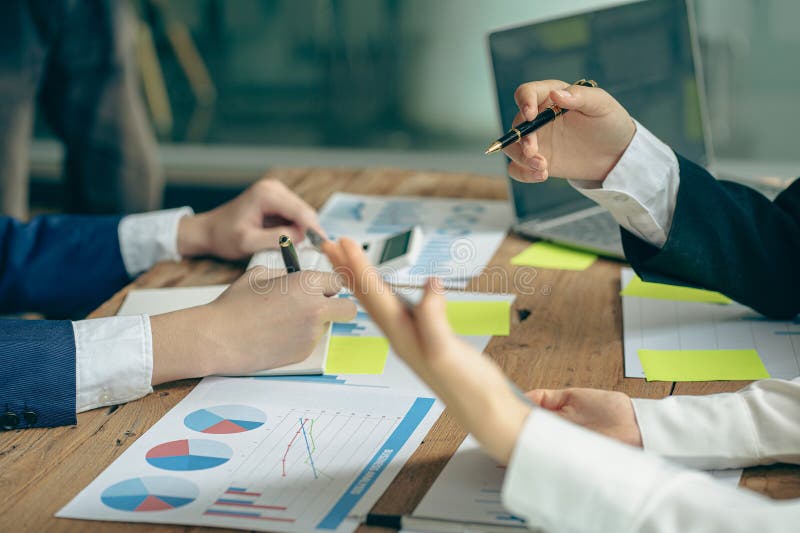 Business Team Analyzing Data Using Computer while Spending Time in ...