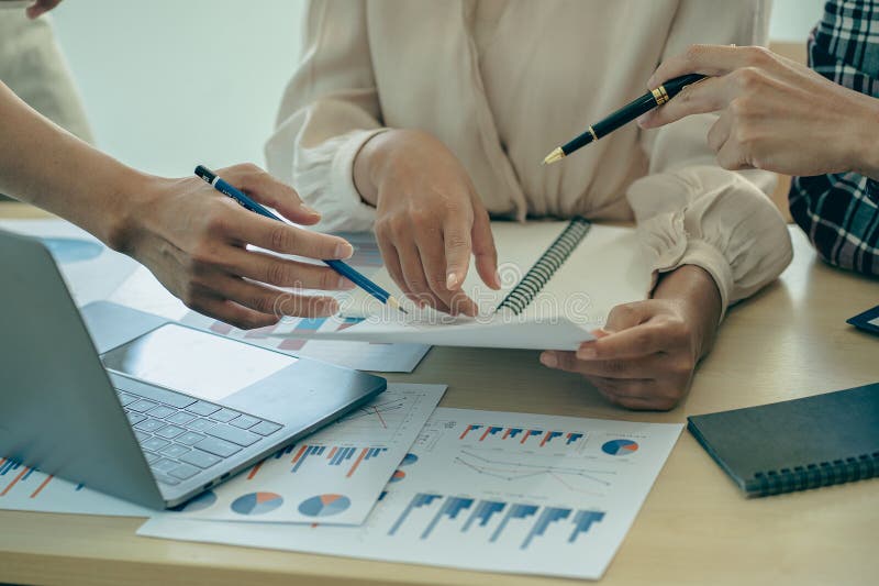 Business Team Analyzing Data Using Computer while Spending Time in ...