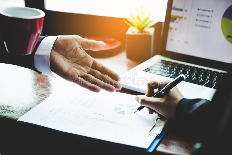 Business Team Analyzing Income Charts and Graphs with Modern Laptop ...