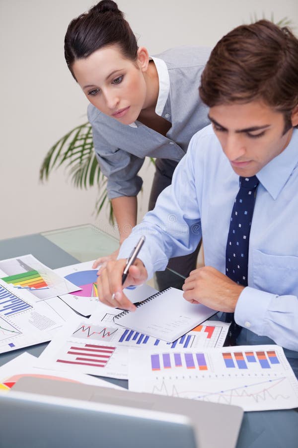 Business Team Analyzing Statistics Together Stock Image - Image of ... Business Team Analyzing Statistics Together Stock Image - Image of ...