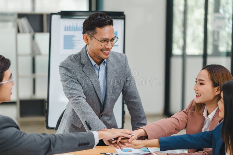 Business Team Celebrating Success with Hand Stack in Modern Office ...