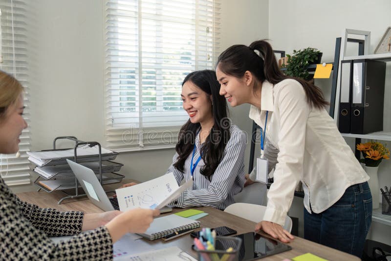 Business Team Collaborating and Analyzing Data in a Modern Office ...