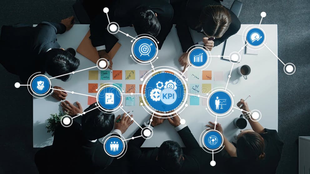 Business Team Collaborating on Key Performance Indicators with Modern Technology and Visual ...