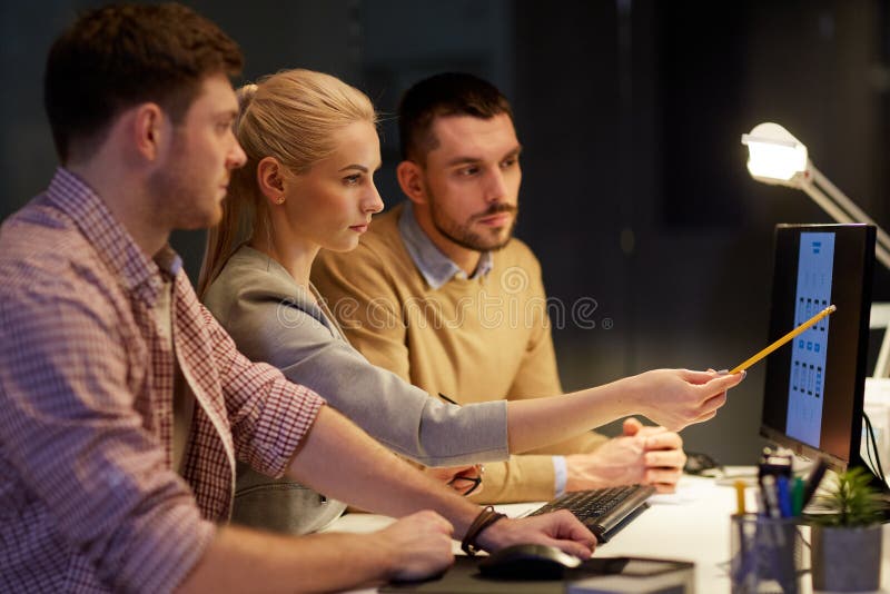 Business Team with Computer Working Late at Office Stock Image - Image ...
