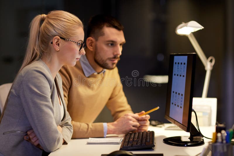 Business Team with Computer Working Late at Office Stock Photo - Image ...