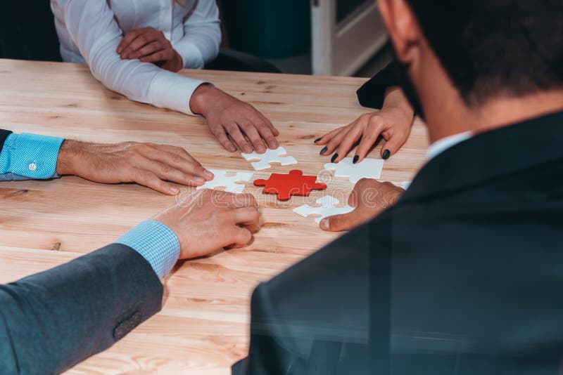 Business Team Connect Pieces of Puzzle Like a Teamwork and Partners ...