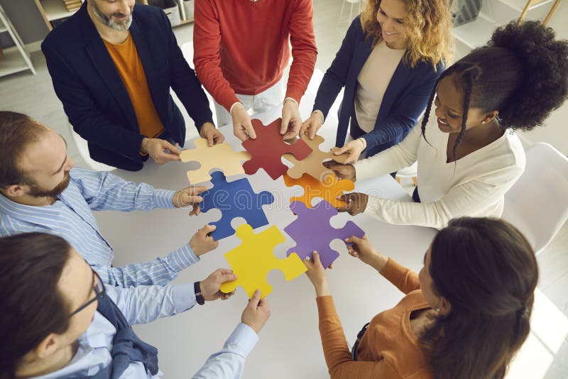 Business Team Connecting Puzzle Parts As Metaphor for Teamwork ...