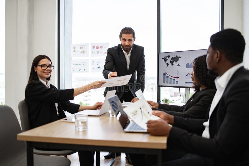 Team Meeting Colleagues Sharing Ideas Analyzing Presentation Charts ...