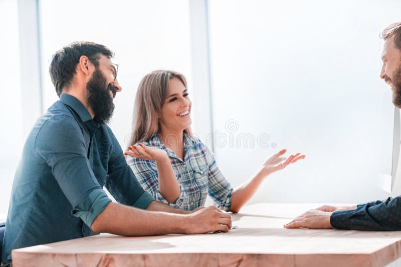 Business Team Discussing Current Tasks at the Desktop. Stock Photo ...