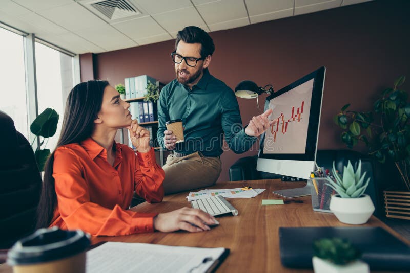 Two Professional Colleagues Collaborating on a Workplace Project at the ...