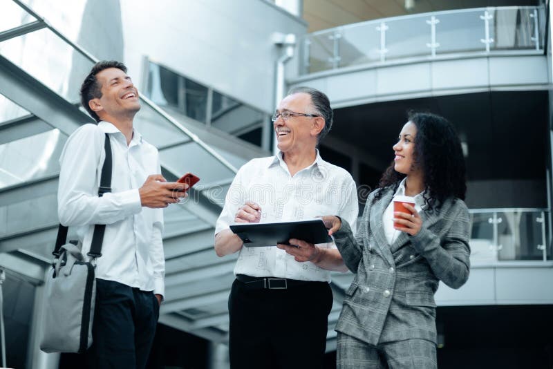 Business Team Discussing a Business Document in the Hall of the ...