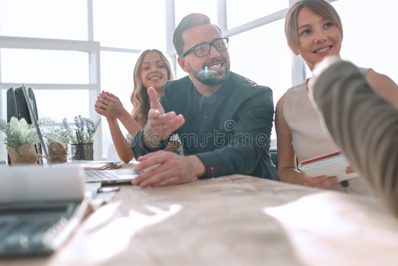 Business Team Discussing Documents Sitting at the Table Stock Image ...