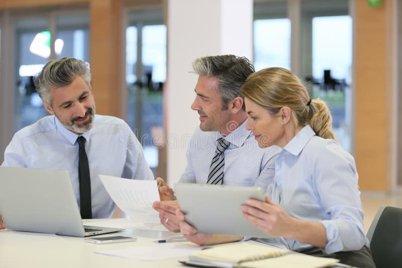 Business Team Meeting and Talking Finances Stock Photo - Image of ...