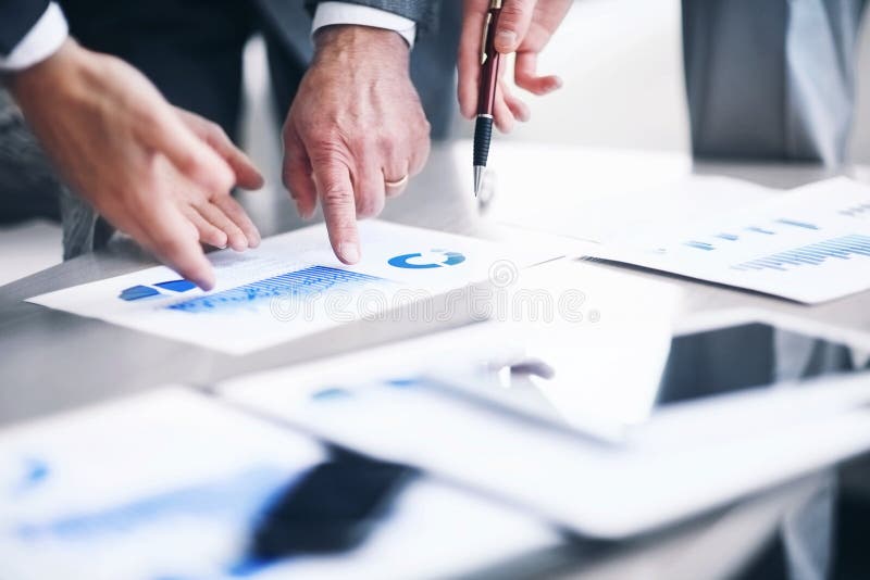Business Team Discussing Financial Charts on a Workplace Stock Image ...