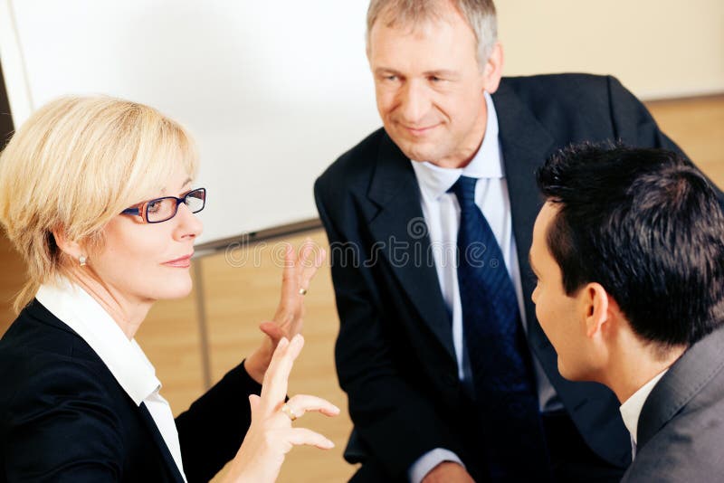 Business Team Discussing a Project Stock Image - Image of businesswoman ...
