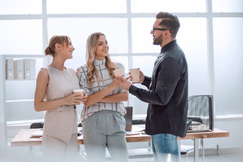 Business Team Discussing Something Standing in the Office Stock Image ... Business Team Discussing Something Standing in the Office Stock Image ...